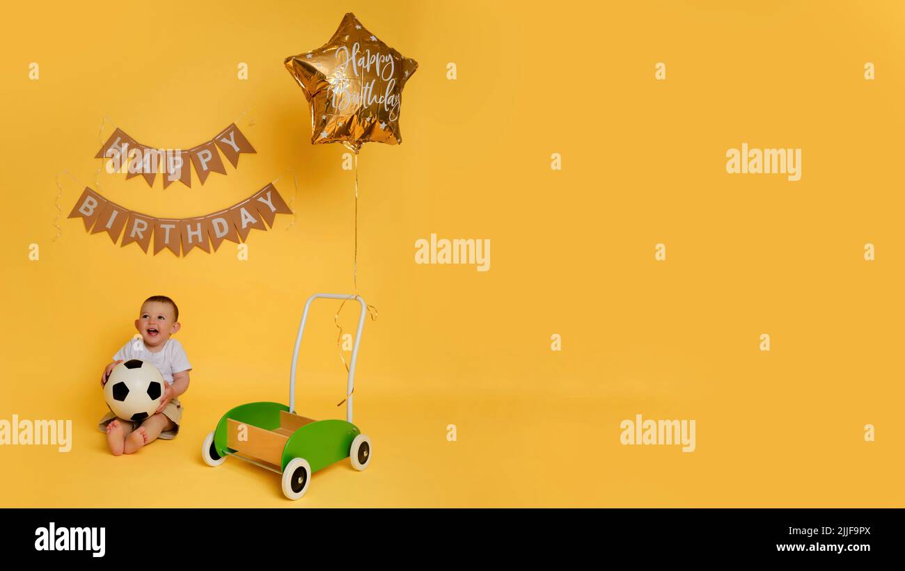 Decorations on a studio yellow background for celebrating the first ...