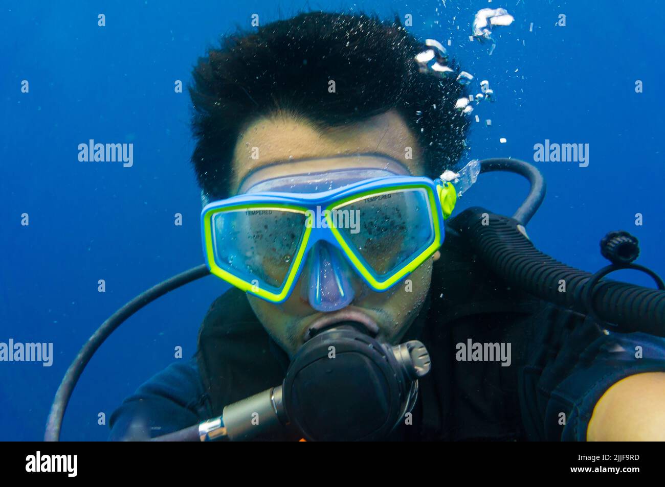 Scuba diving man with mask and underwater wetsuit take selfies photo ...