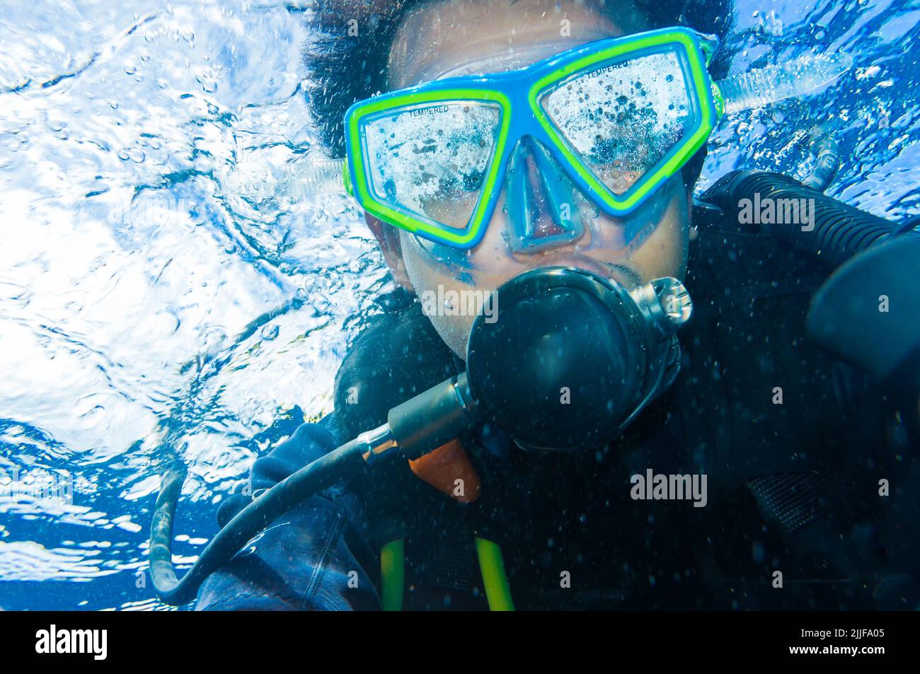 Scuba diving man with mask and underwater wetsuit take selfies photo ...