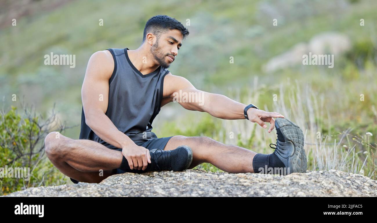 Always stretch before and after training. Full length shot of a ...