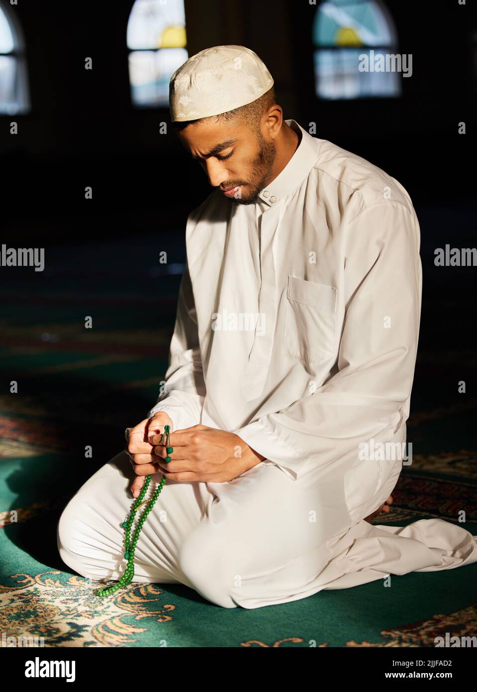 We are to pray in times of prosperity. a young muslim male praying in a ...