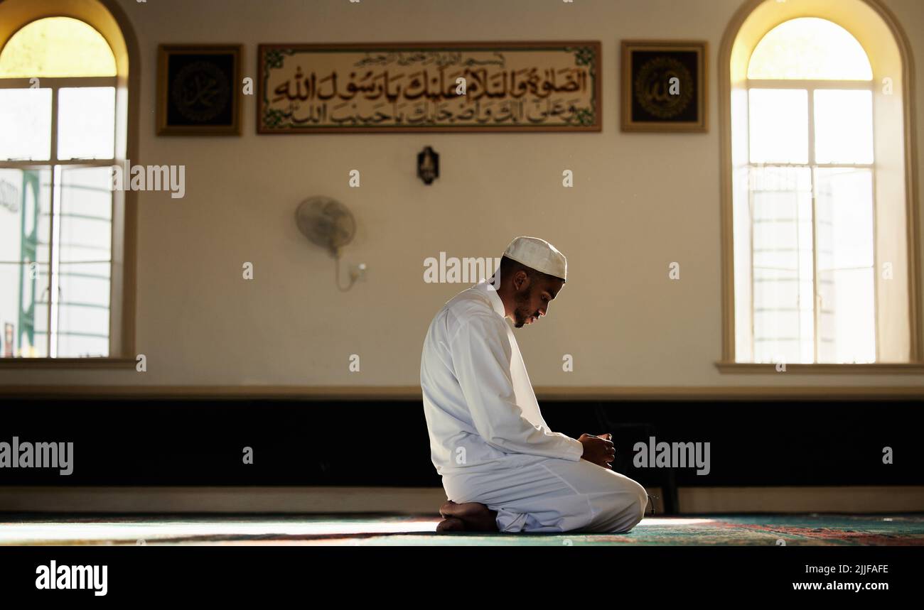 Never underestimate the power of Dua. a young muslim male praying in a ...