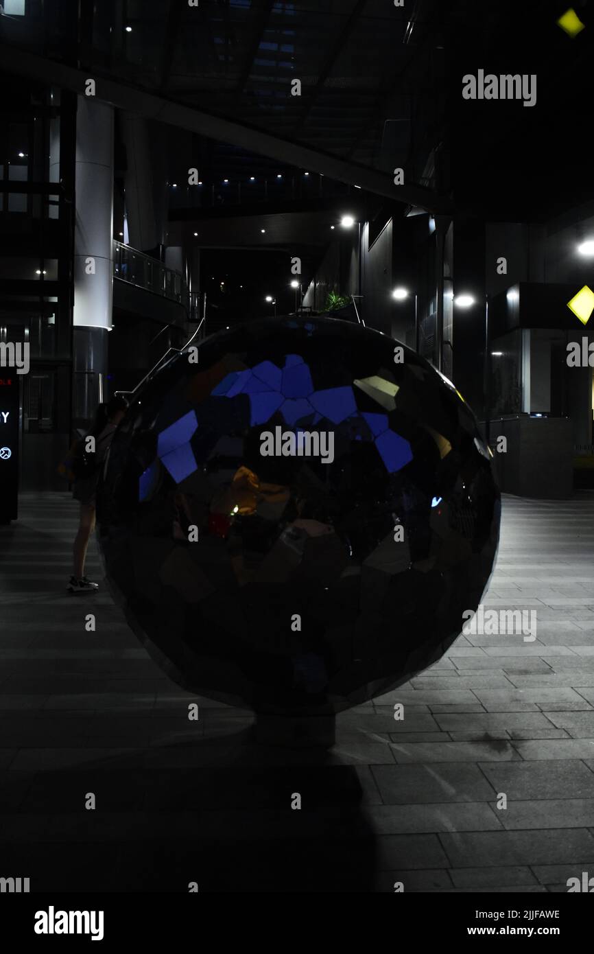 The Reflective Geometric Ball in the city of Stock Photo - Alamy