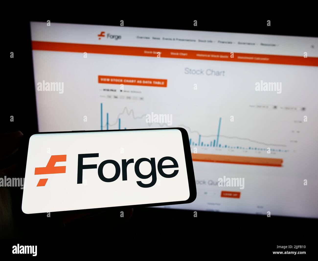 Person holding mobile phone with logo of American financial company Forge Global Inc. on screen ...