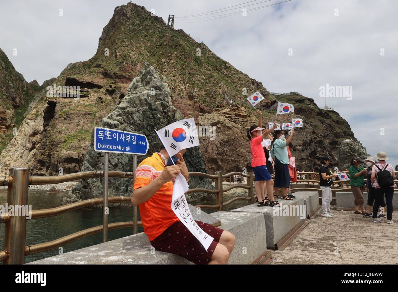 26th July, 2022. Visiting Dokdo Visitors holding the national flag pose for a photo during a ...