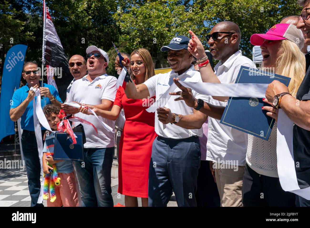 New York City Mayor Eric Adams cuts a ribbon during an Egyptian ...
