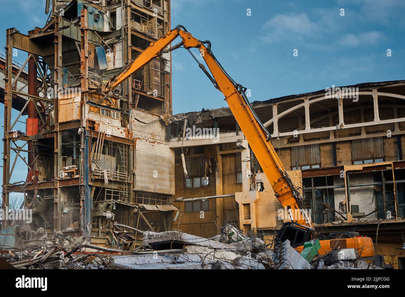 Destroying of old industrial building by excavator destroyer Stock ...