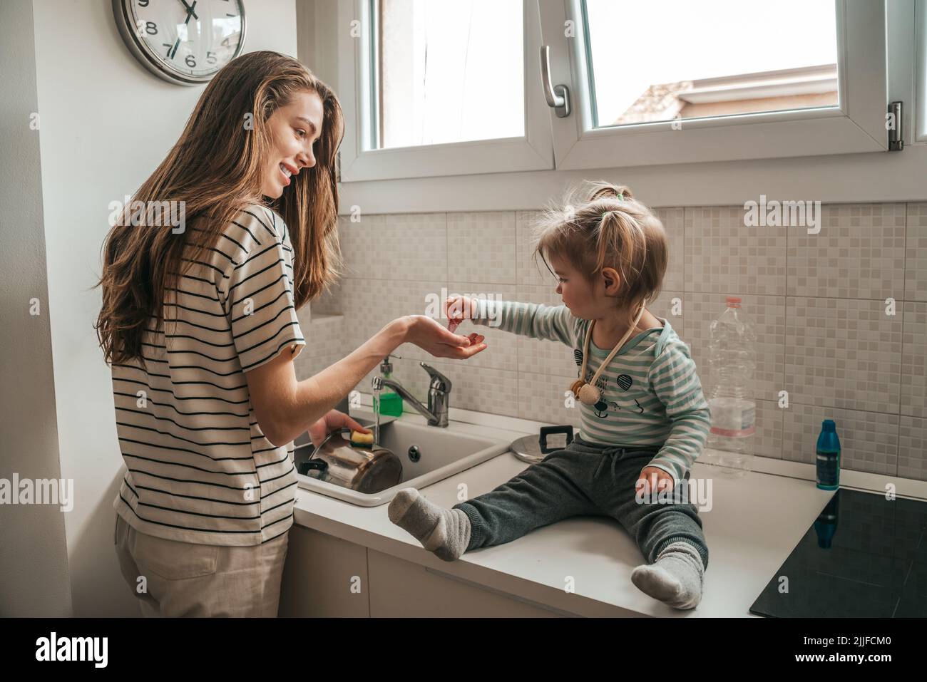 Child doing housework hi-res stock photography and images - Alamy