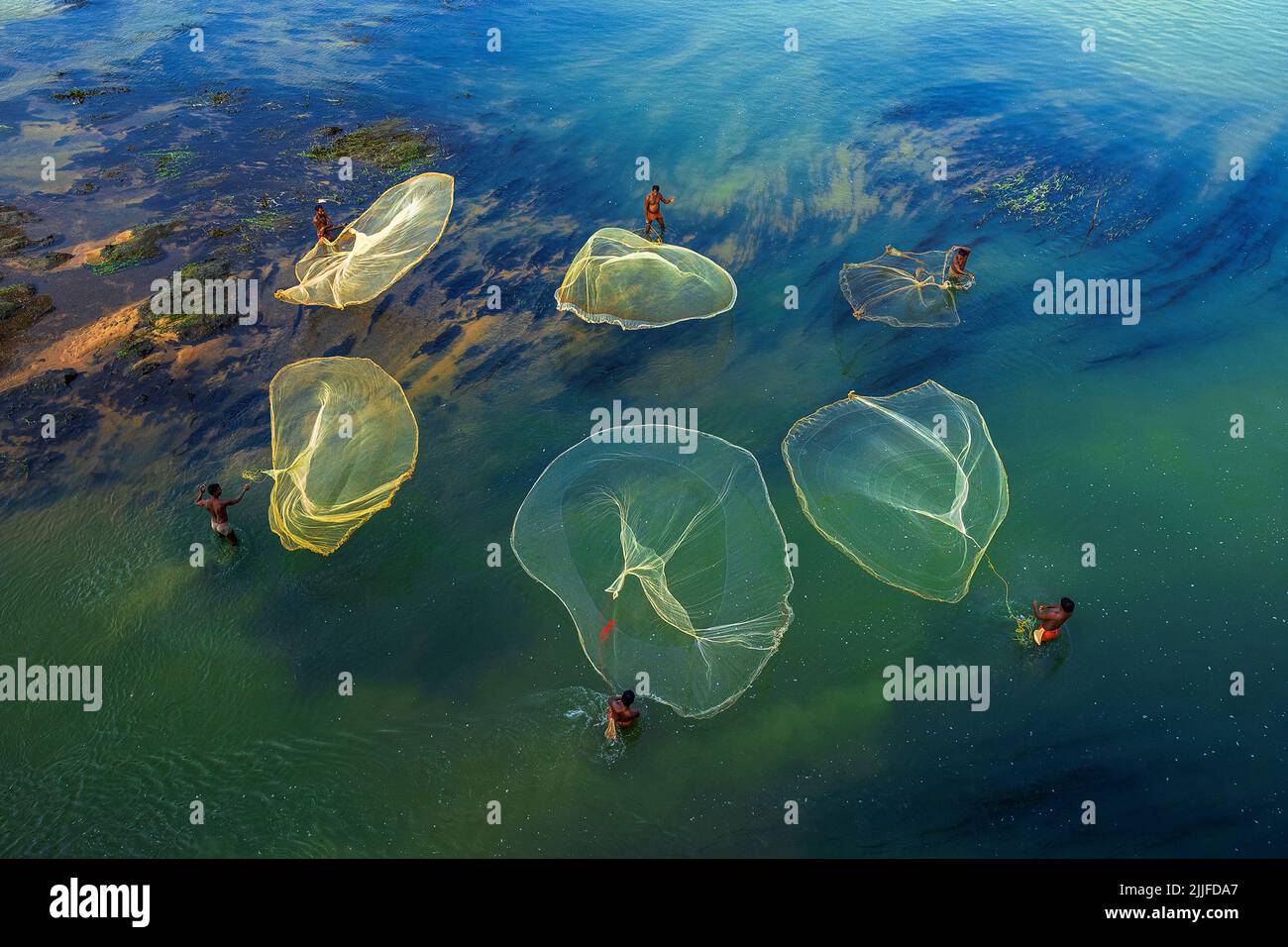 Fisherman throwing their large nets. West Bengal, India: IMAGES show ...