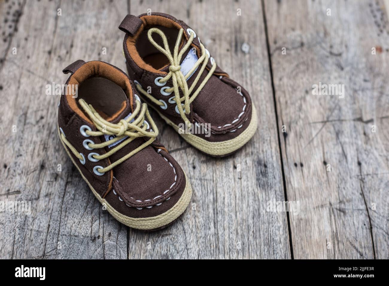 Denim texture of kids vintage shoe on wood background Stock Photo - Alamy