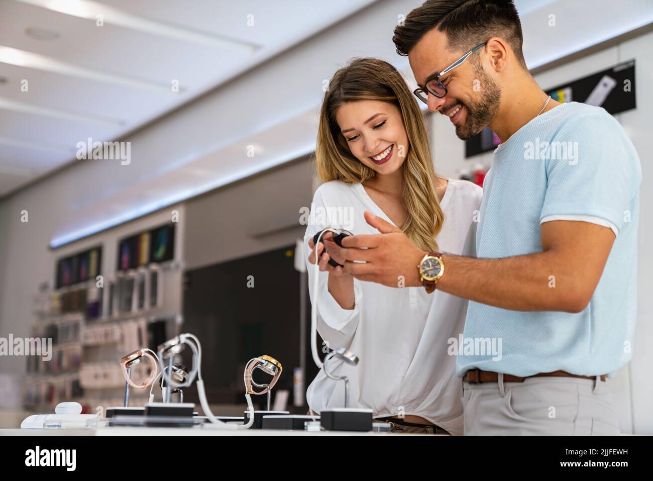 Technology people smart devices concept. Happy couple buying new smart ...