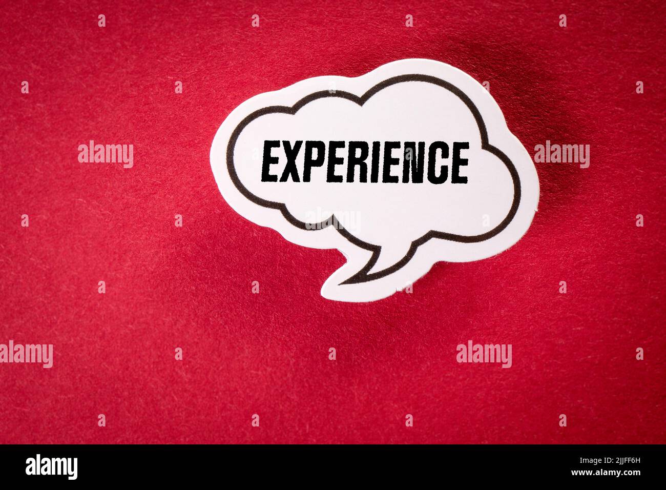 EXPERIENCE. White speech bubble with text on red background Stock Photo ...