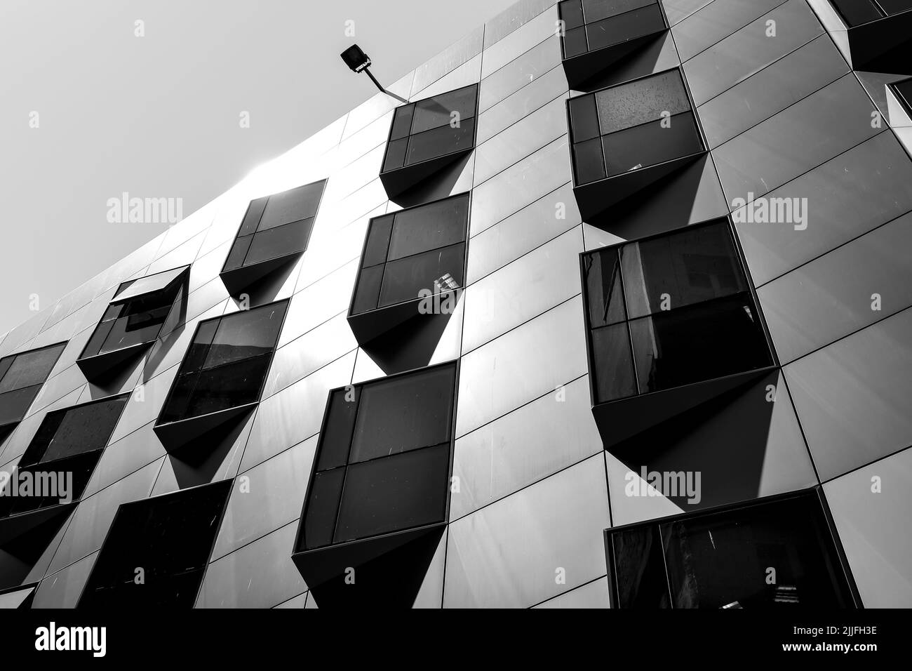 Rectilinear and geometric facade with glass windows of the Town Hall of ...