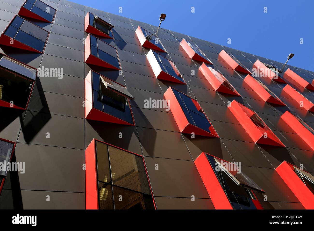 Rectilinear and geometric facade with glass windows of the Town Hall of ...