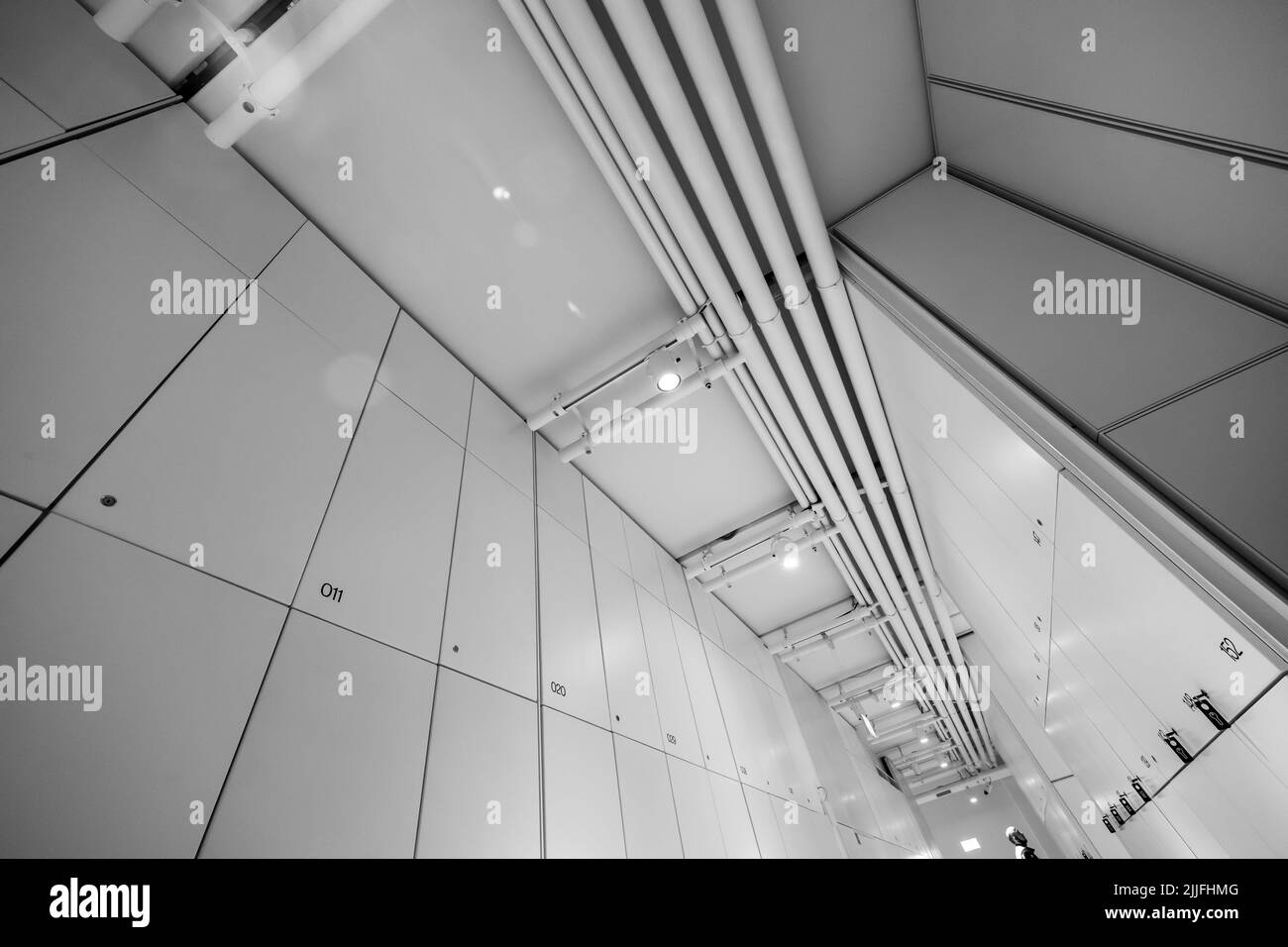 Pipes on ceiling in corridor Stock Photo - Alamy