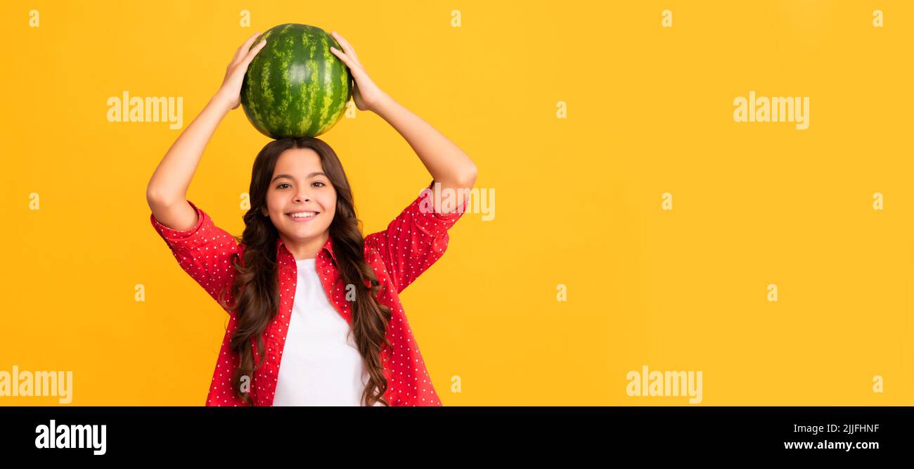happy kid holding heavy fresh ripe water melon fruit in summer straw ...