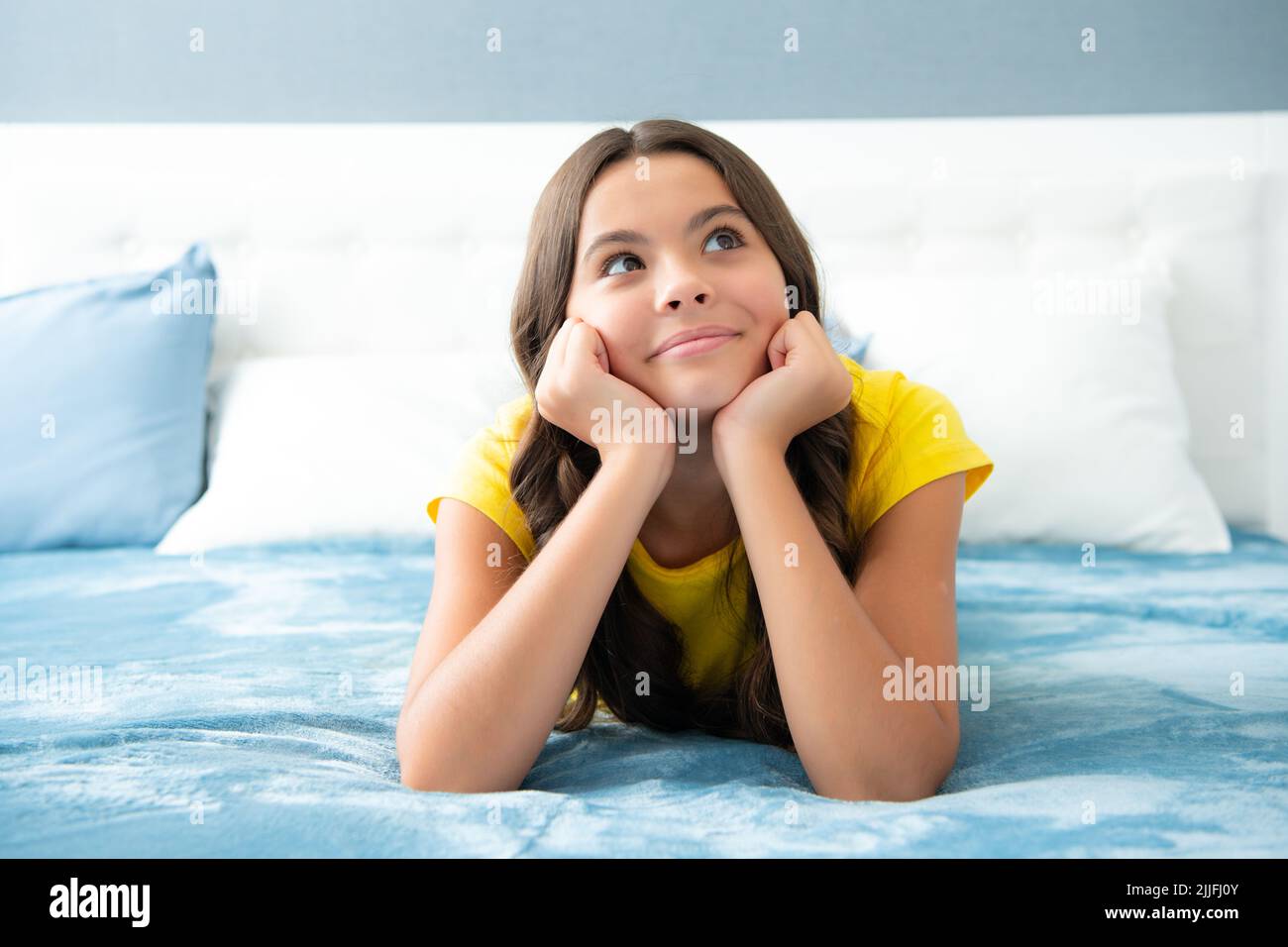 Teenager child girl daydreaming in bed, dreaming kids concept. Kid ...