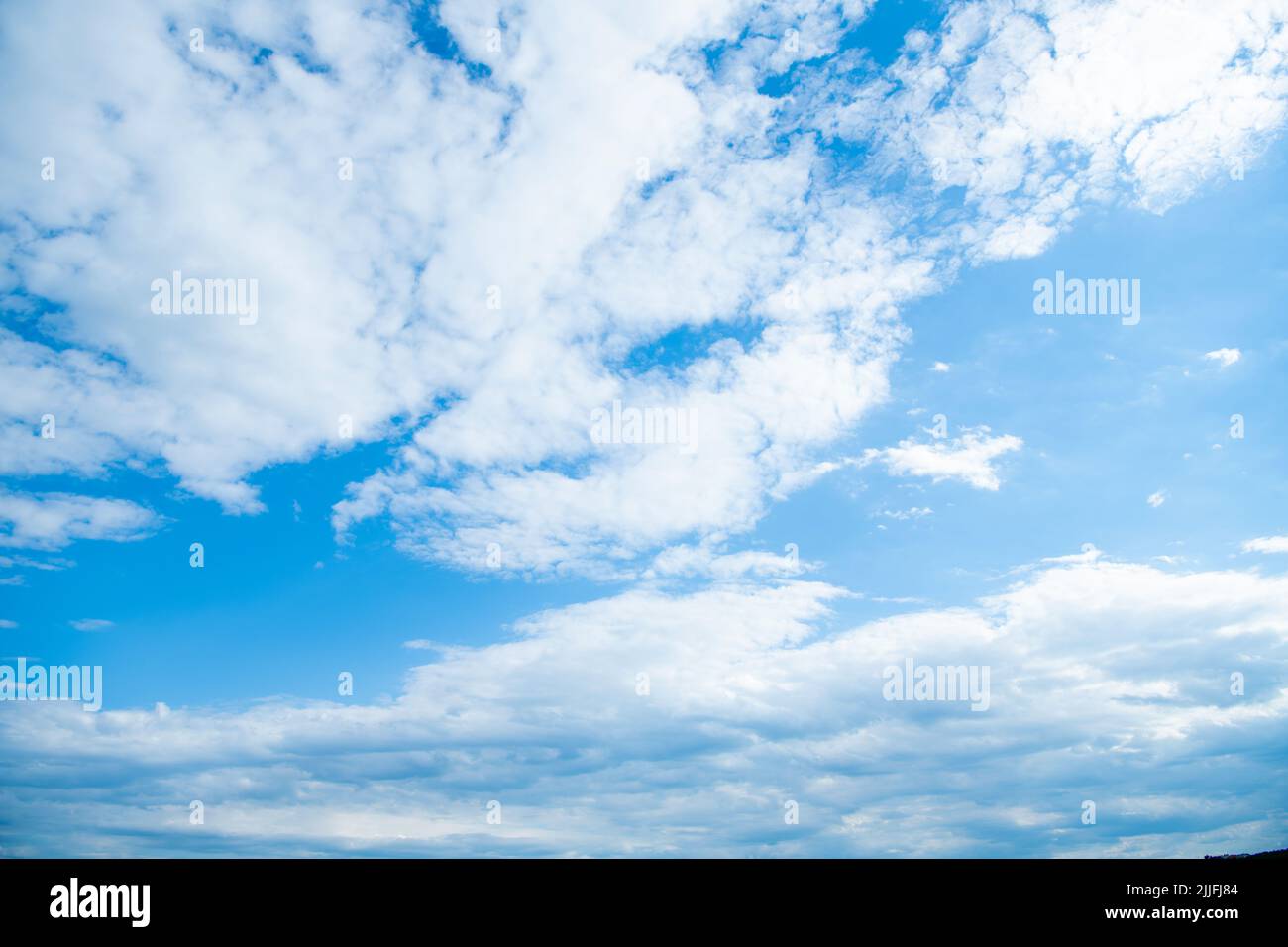 blue cloudscape background with white fluffy clouds Stock Photo - Alamy