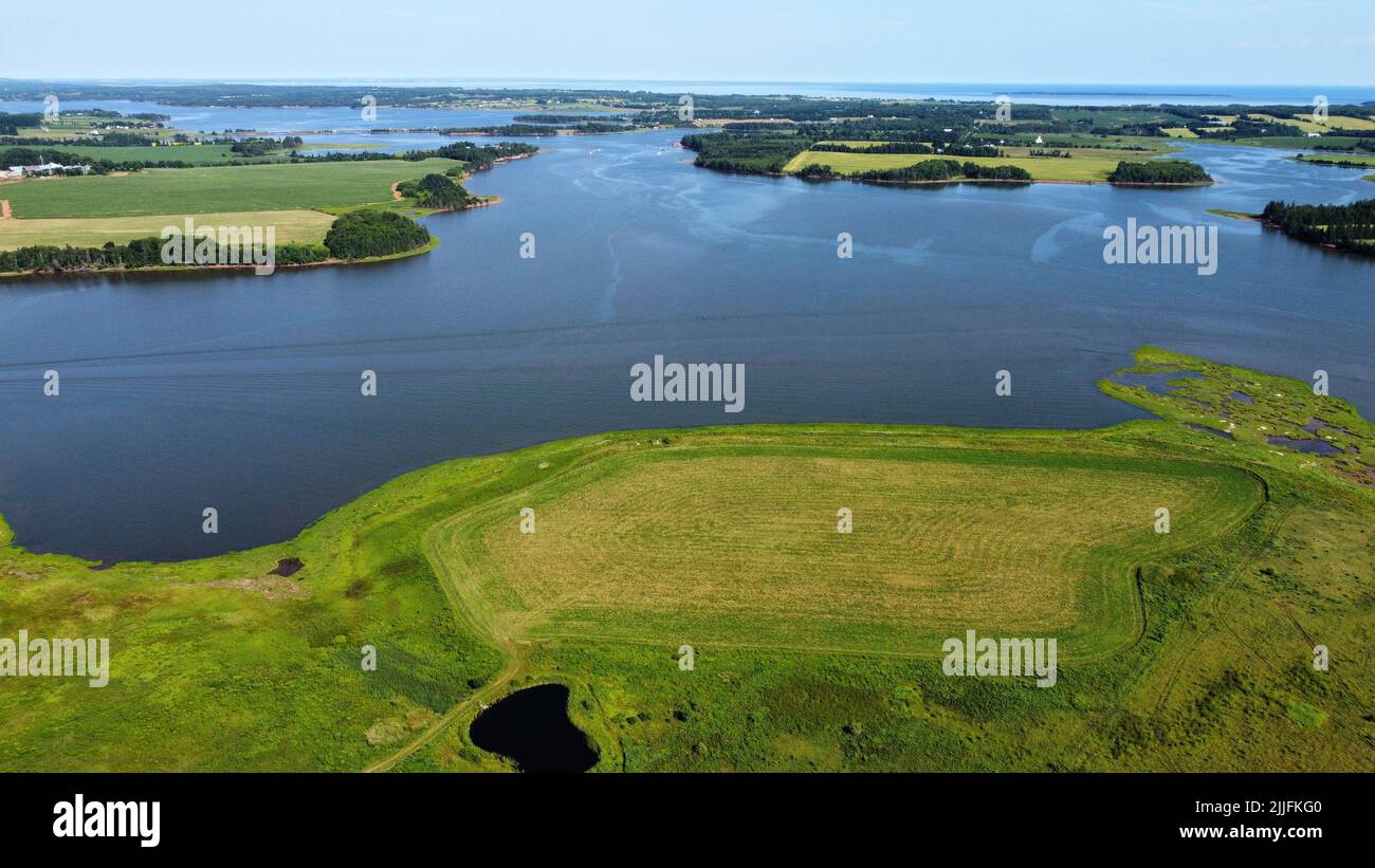 An aerial view of a curvy river surrounded by land Stock Photo - Alamy