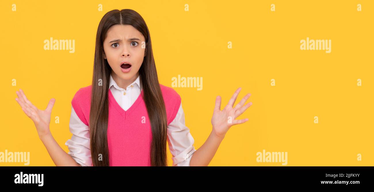 shocked teen school girl smiling with long hair on yellow background ...