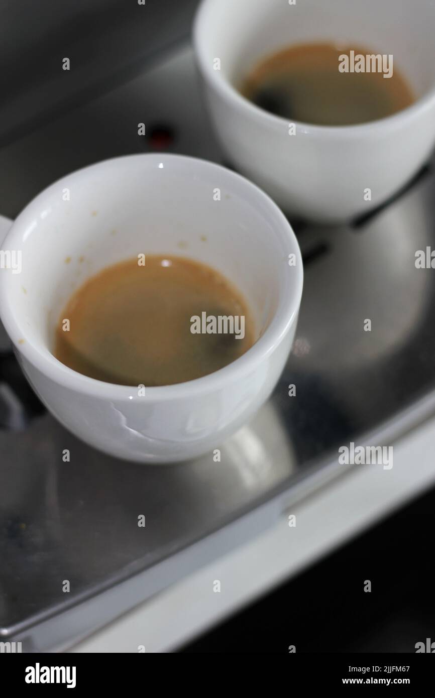 Two Cups of Just Made Espresso Shots on Metal Background. Brewing ...