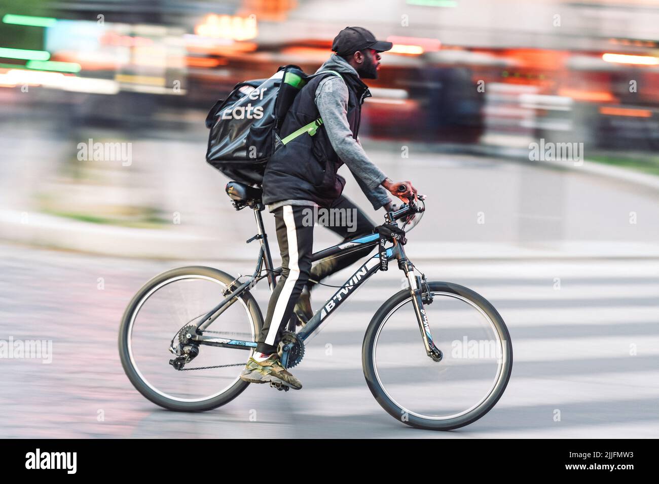 A deliver for Uber Eats on his bike (bicyle). Illustration of delivers ...
