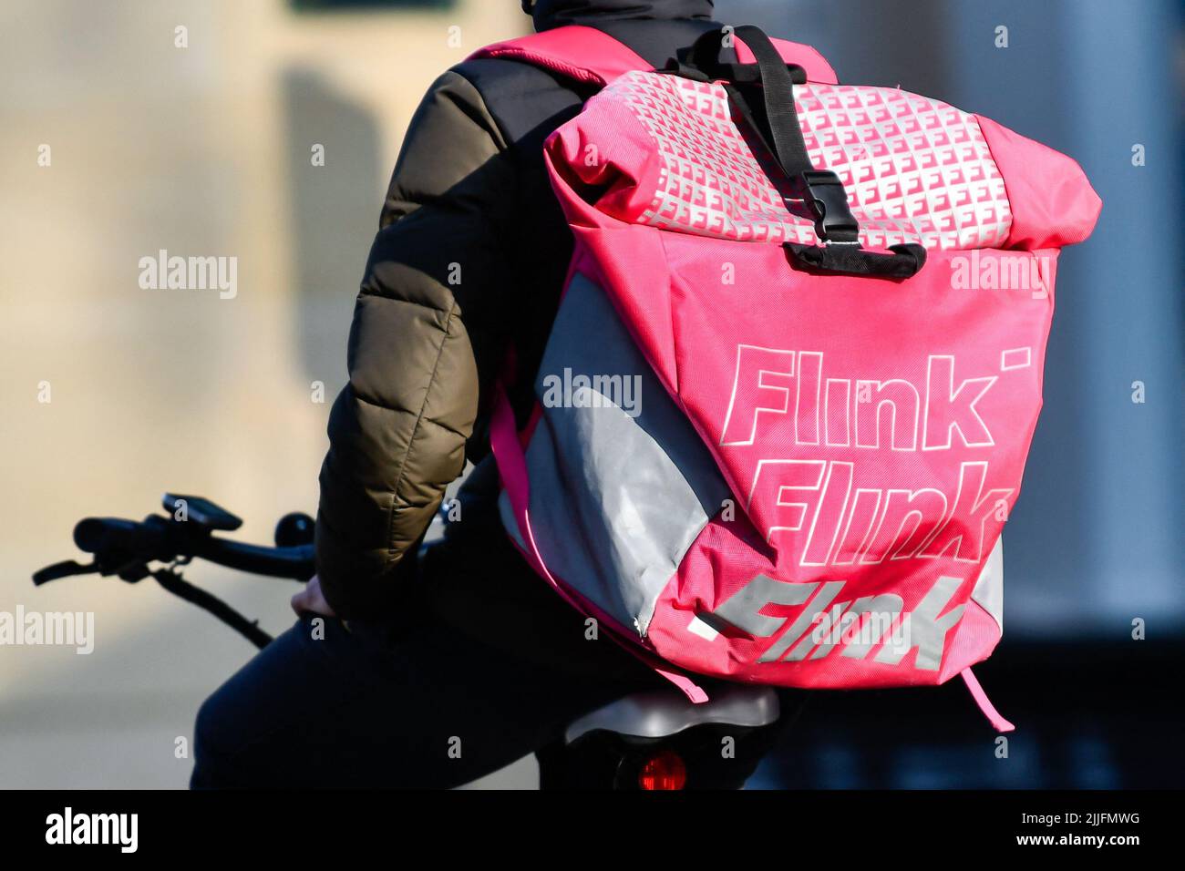 A deliver for Flink on his bike (bicyle). Illustration of delivers for ...