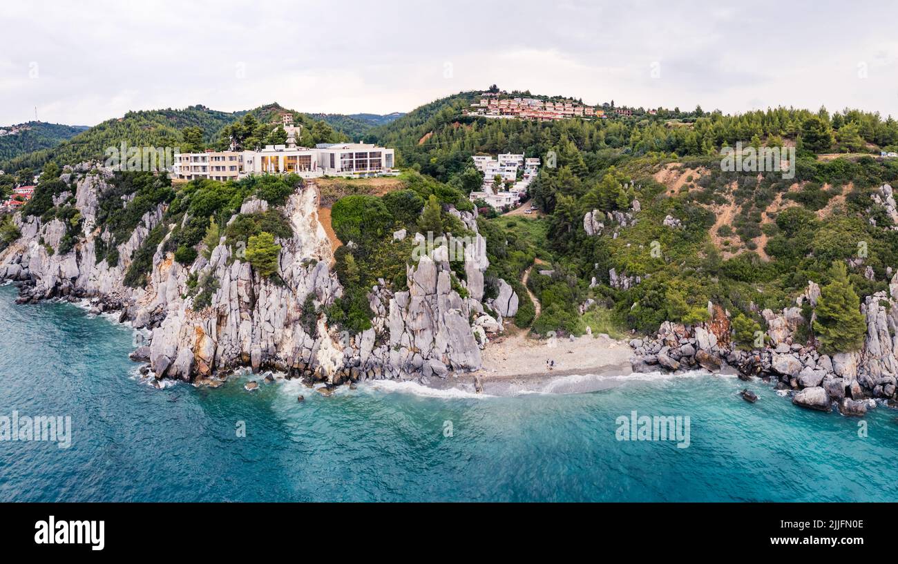 Drone perspective of famous Kassandra cliffs in Greece. Turquoise water ...