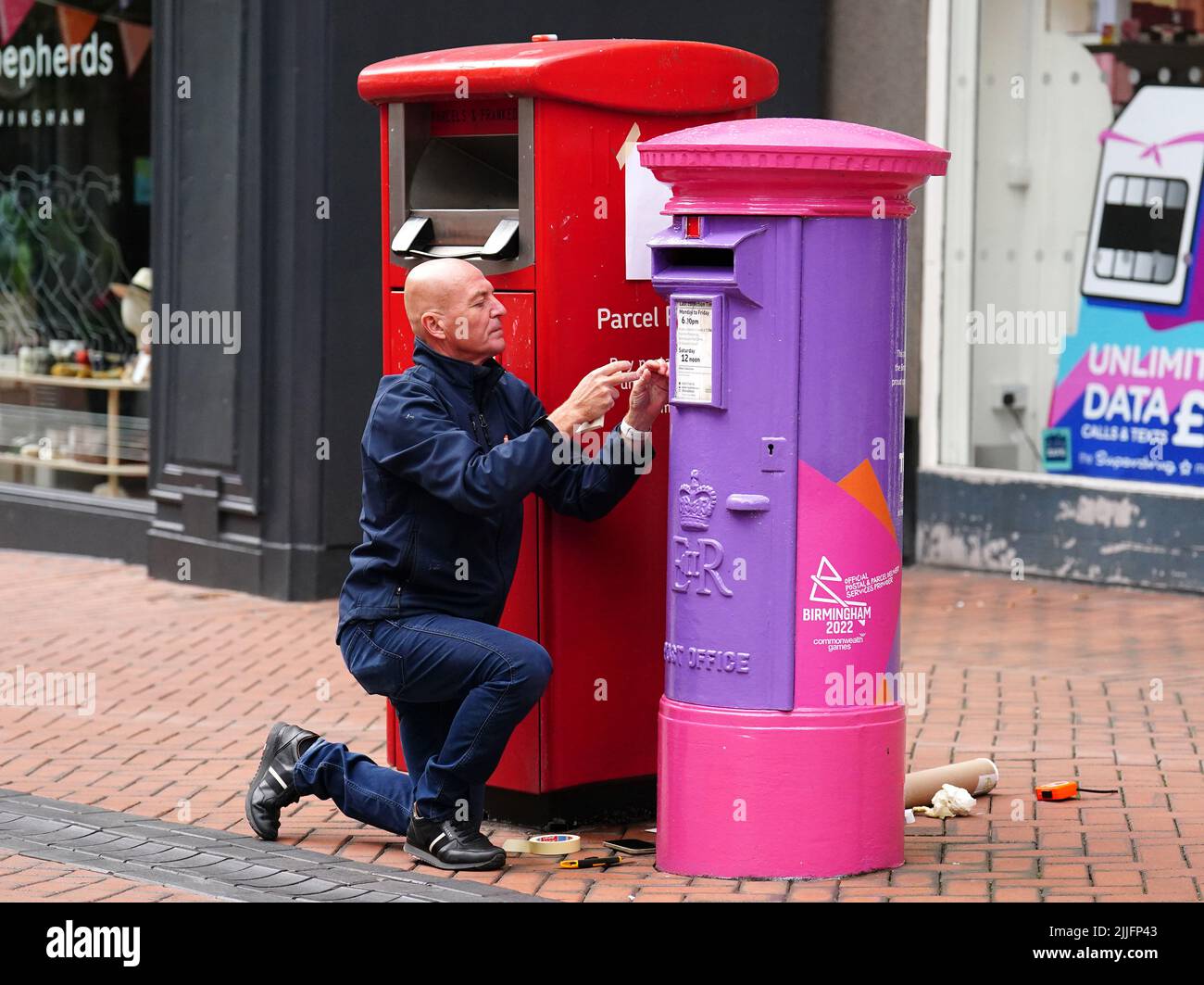 A Royal Mail postbox is decorated in Commonwealth Games colours ahead ...