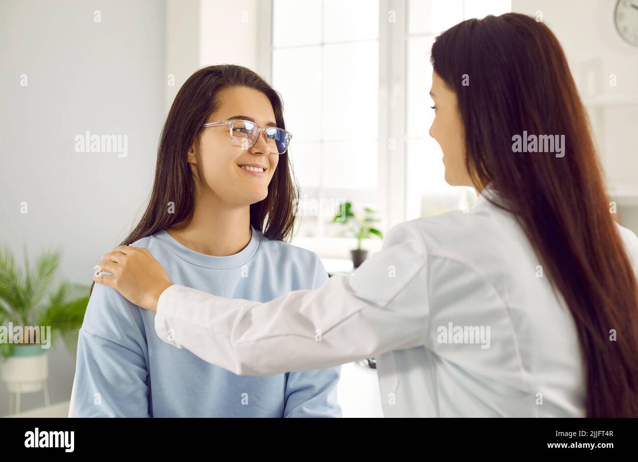Doctor consults young patient consulting hi-res stock photography and ...