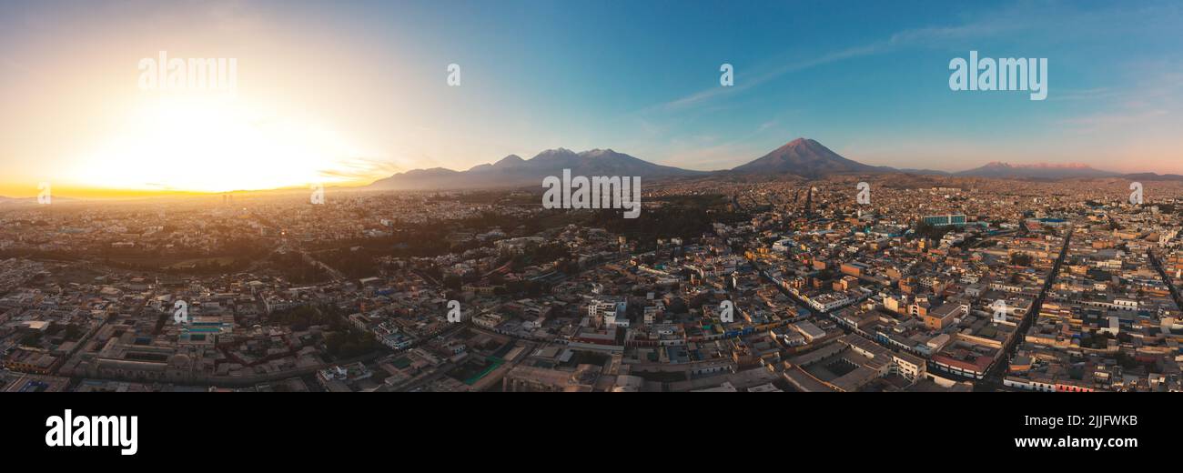 Aerial view of a sunset in Arequipa city with Chachani volcano as ...
