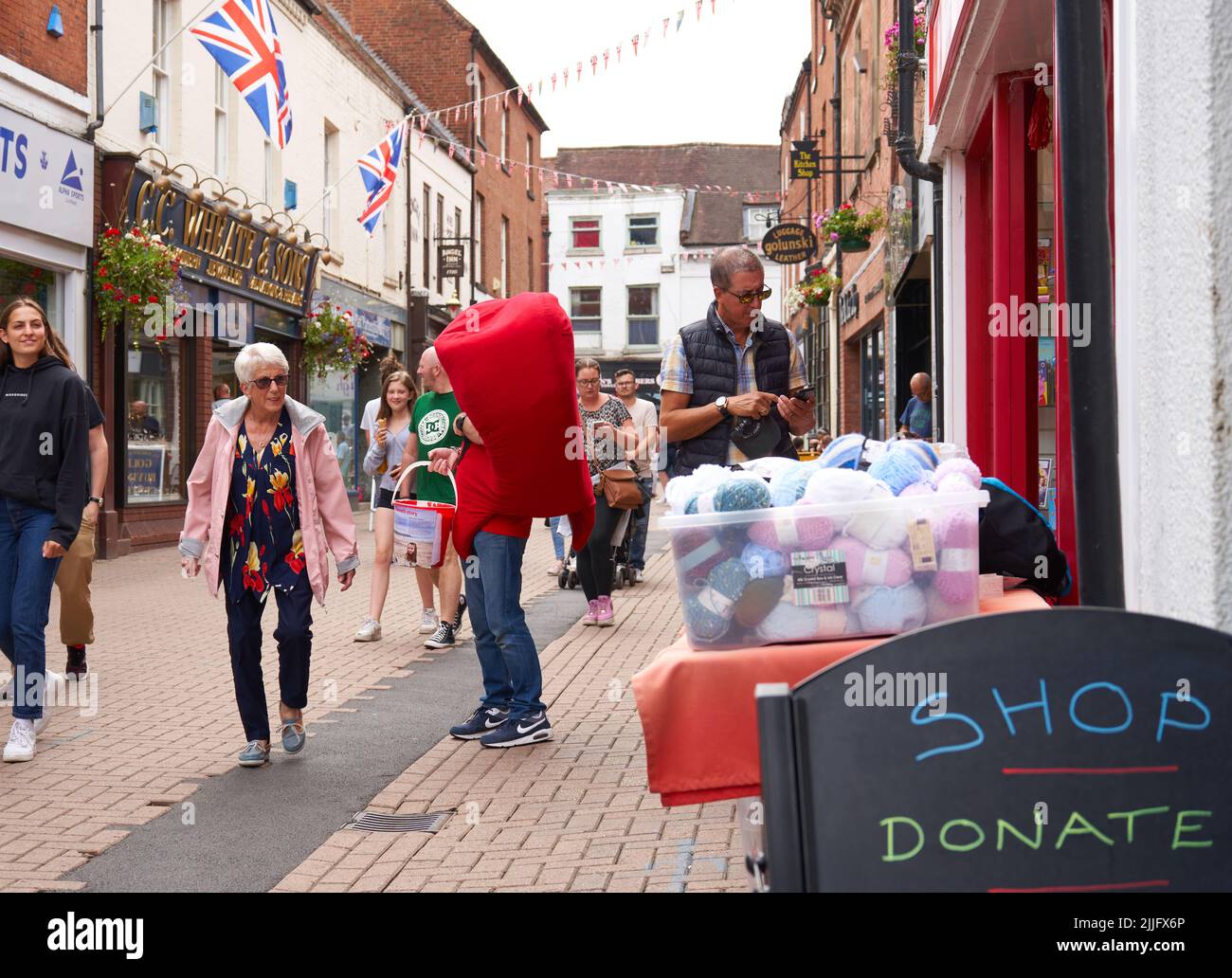 Shoppers on a high street in Lichfield, Staffordshire, UK Stock Photo ...