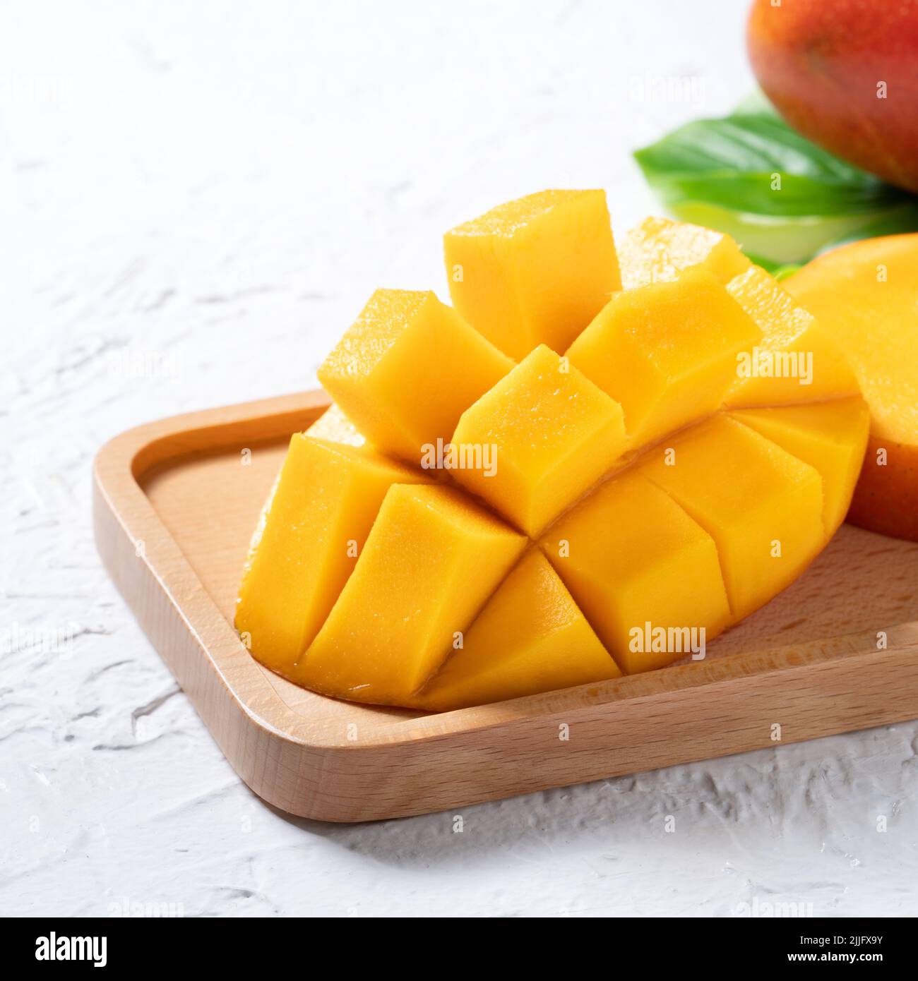 Mango background design concept. Top view of diced fresh mango fruit ...