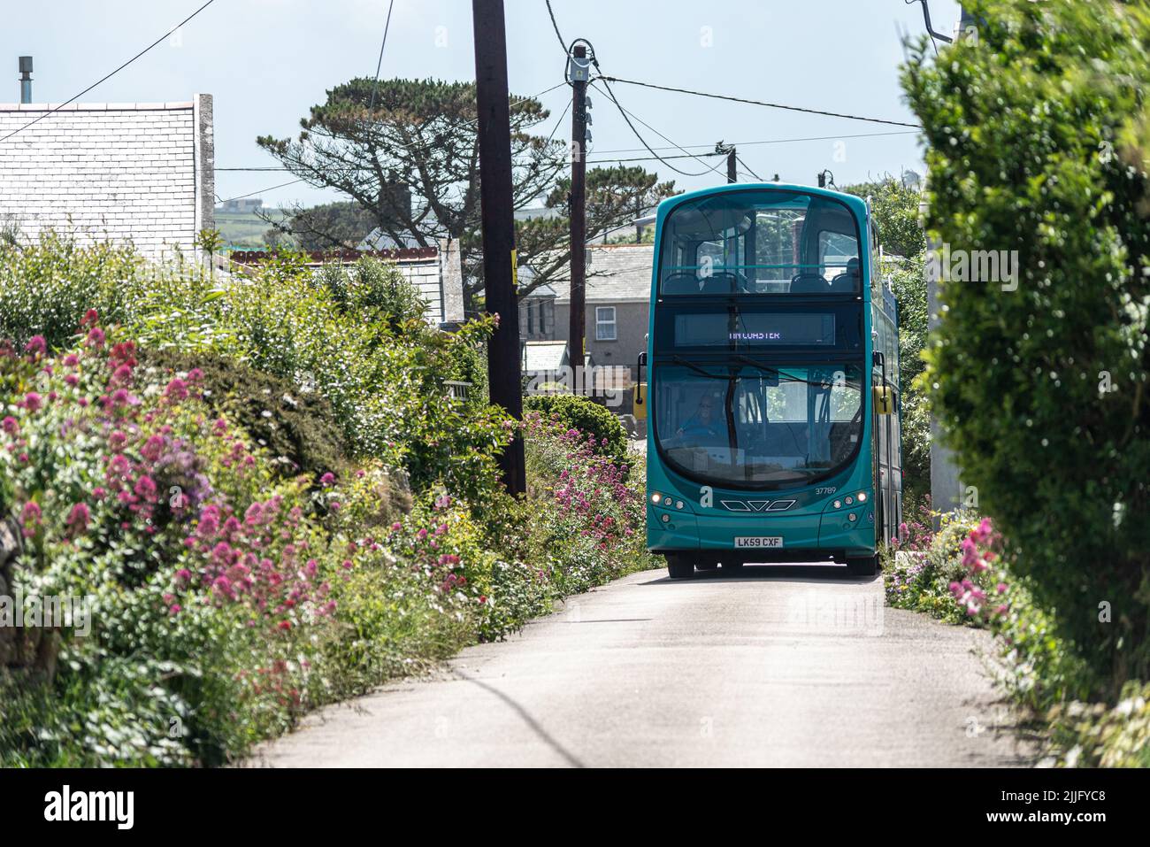 double decker bus driving the narrow lanes in cornwall , uk , June 10 ...