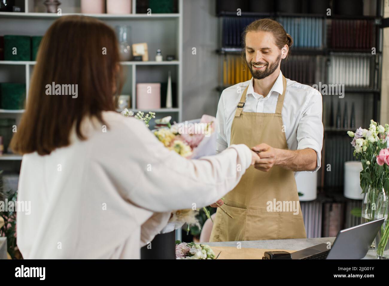 Businessman making bill in shop hi-res stock photography and images - Alamy