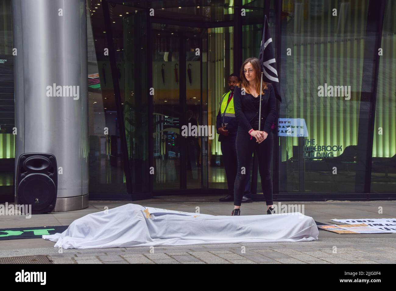 London, UK. 26th July 2022. Extinction Rebellion activists covered with ...