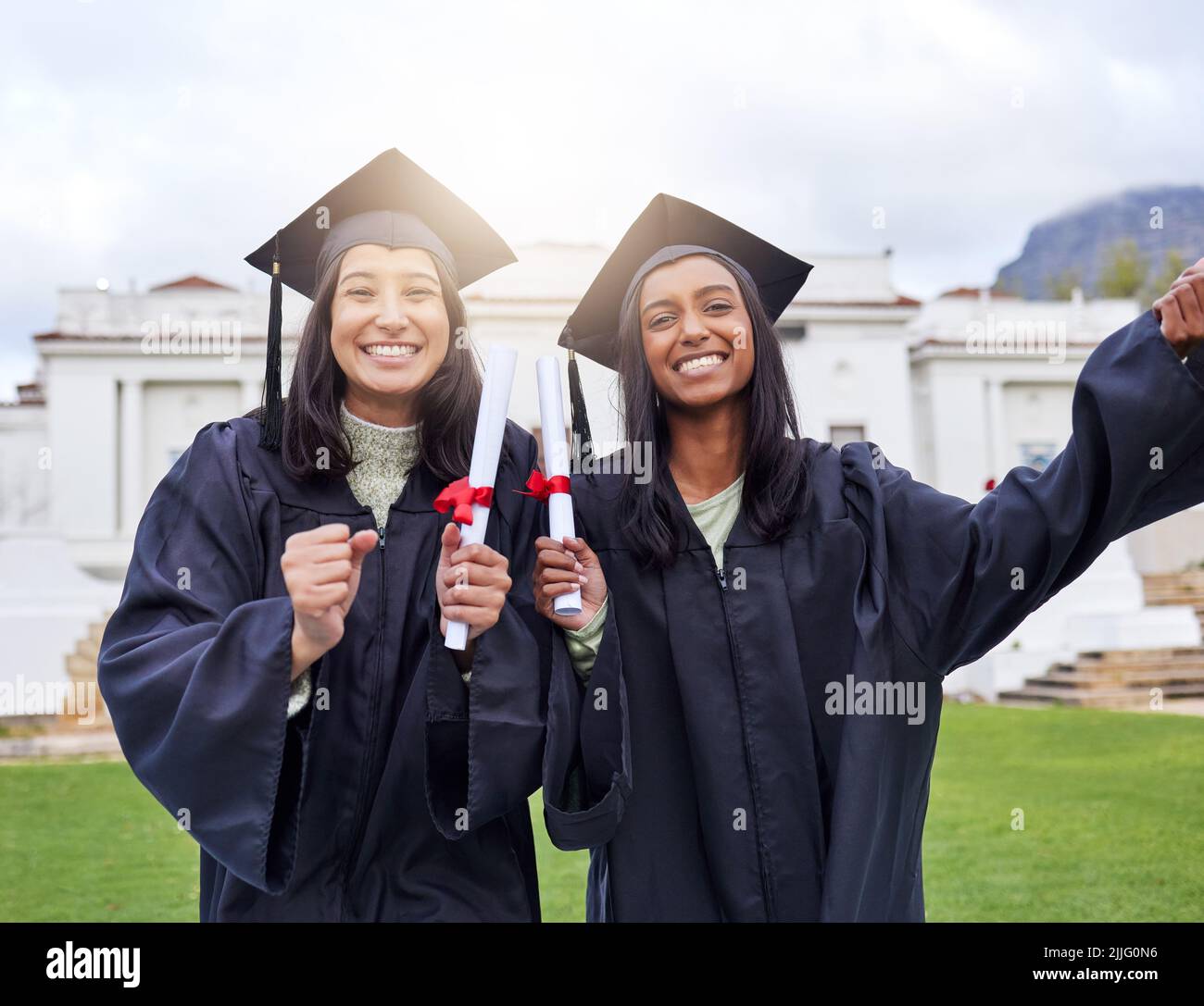 were officially qualified. Cropped portrait of two attractive young ...