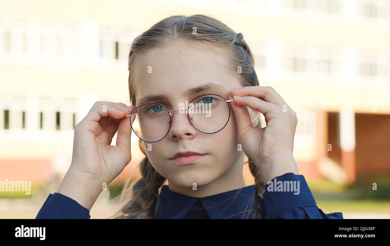 Child wearing glasses in a classroom hi-res stock photography and ...