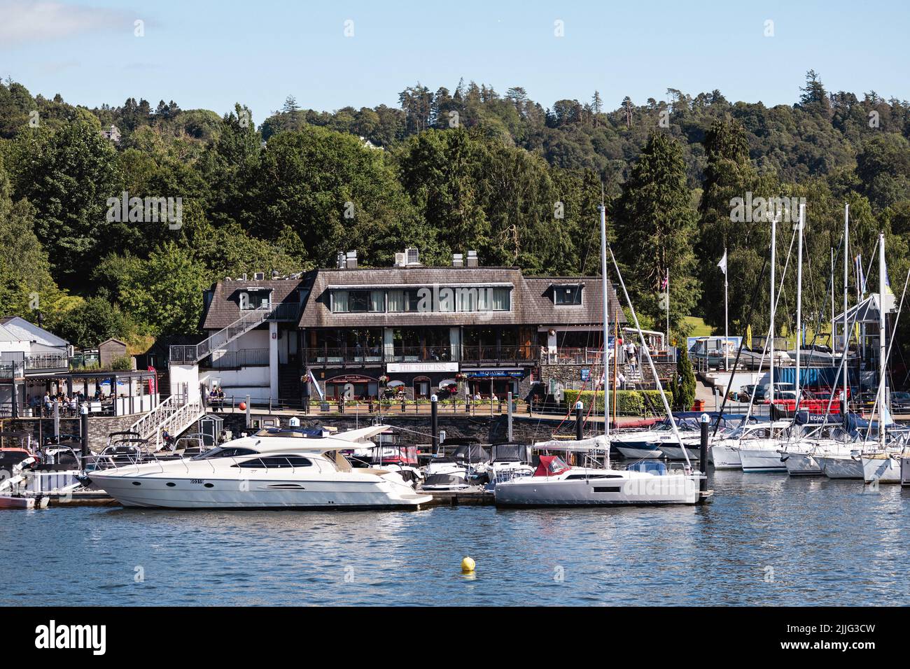 Bright sun blue sky Bowness Bay on Lake Windermere The National Park ...