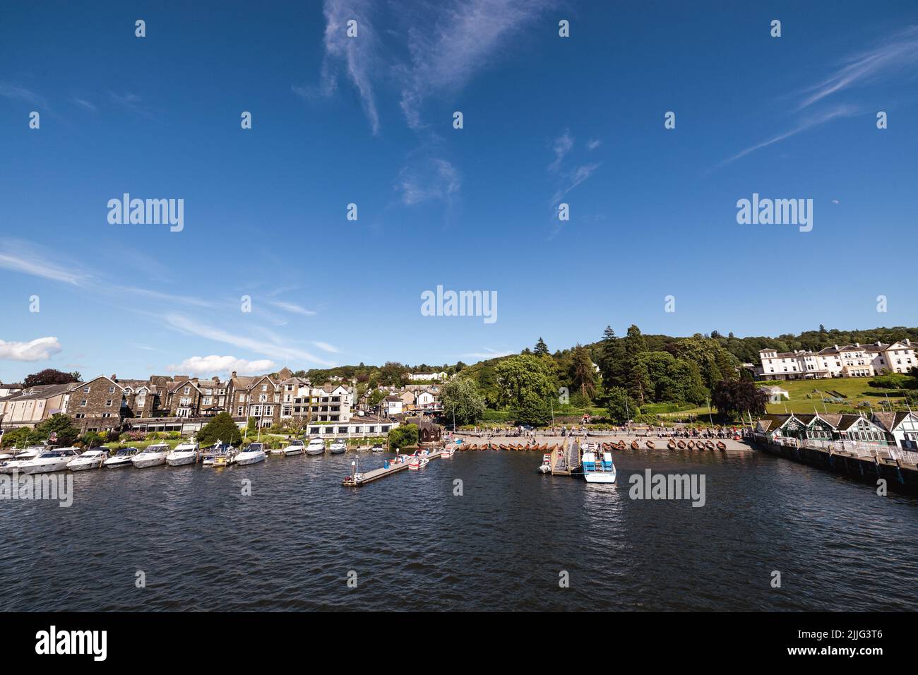 Bright sun blue sky Bowness Bay on Lake Windermere The National Park ...