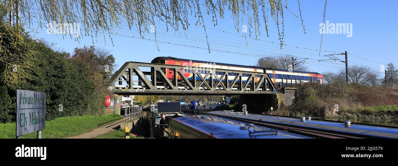 EMR 158 799 into Ely station over the river Great Ouse embankment, Ely ...