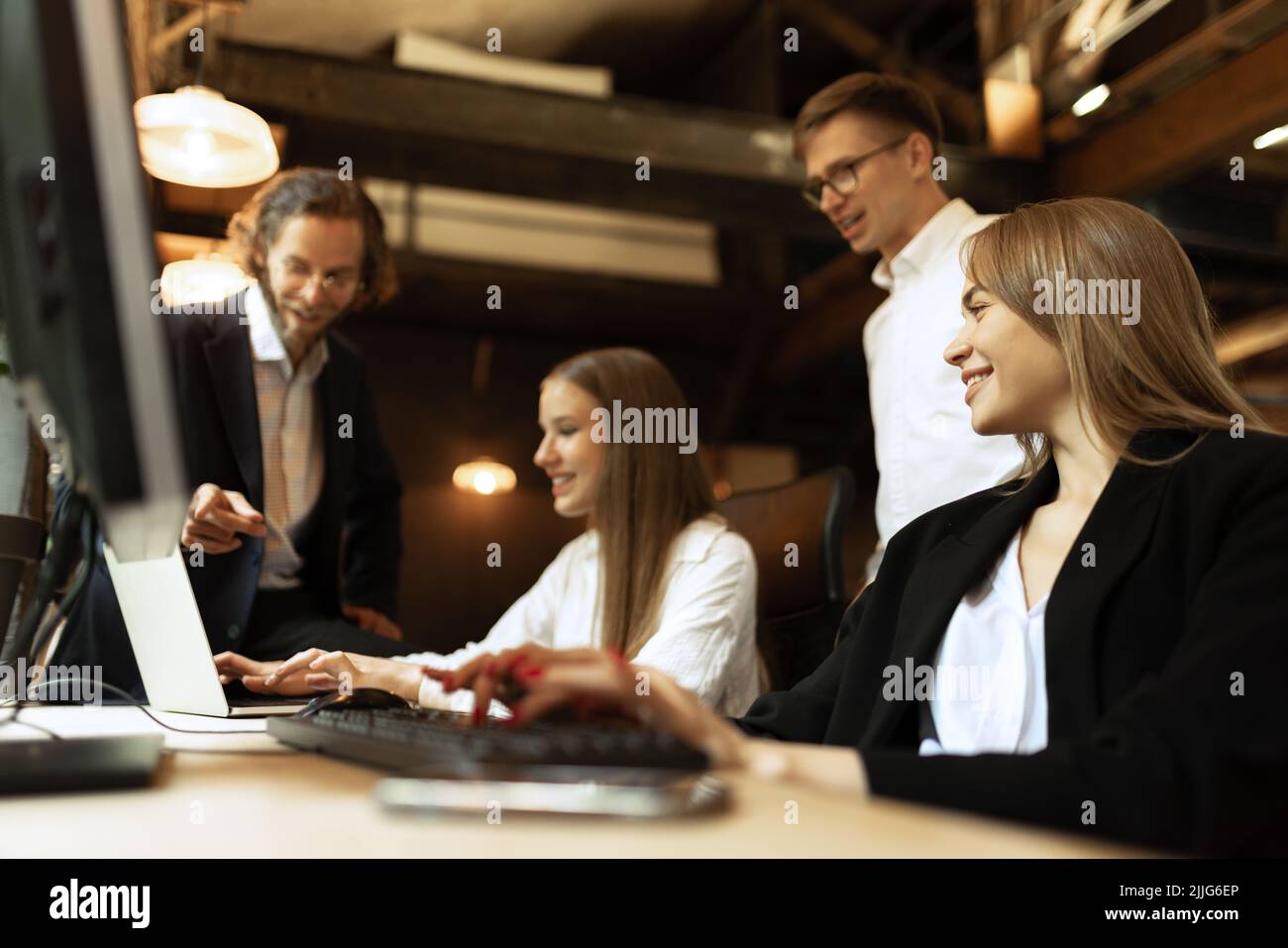 Group of young people having lesson on computer science with ...