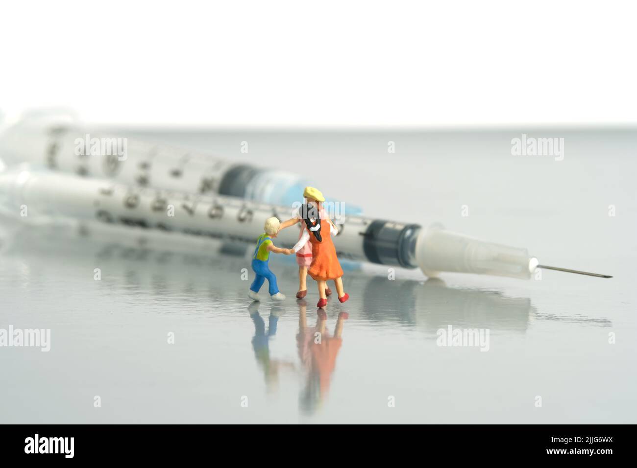 Miniature people toy figure photography. Vaccination for kids concept ...