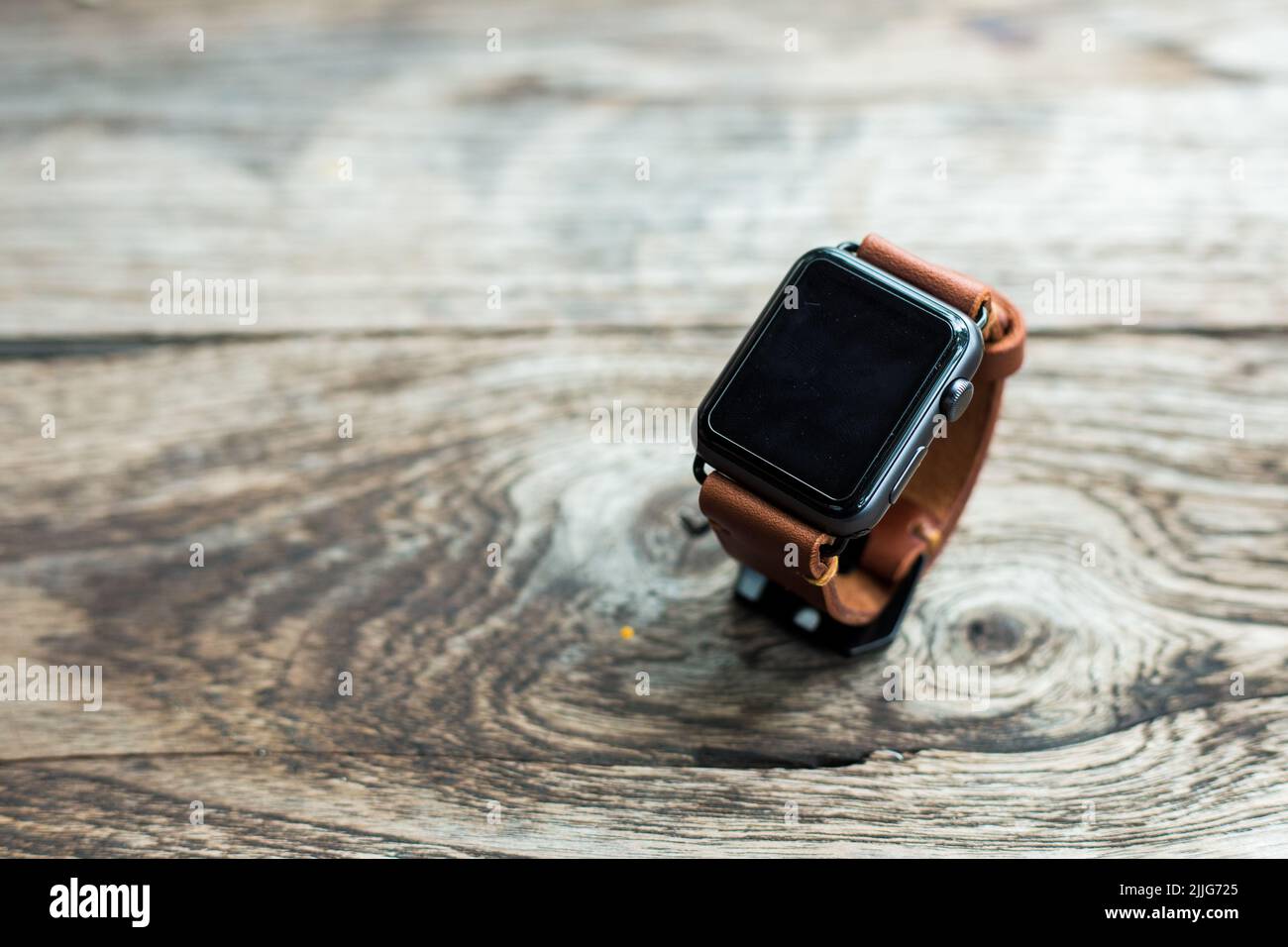 Genuine brown leather watch strap on wood background, Craftsmanship ...