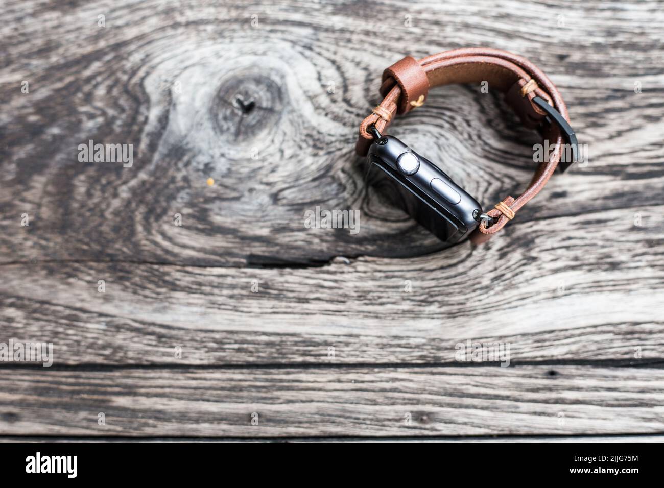 Handmade brown leather vintage watch strap craftsmanship on wood ...