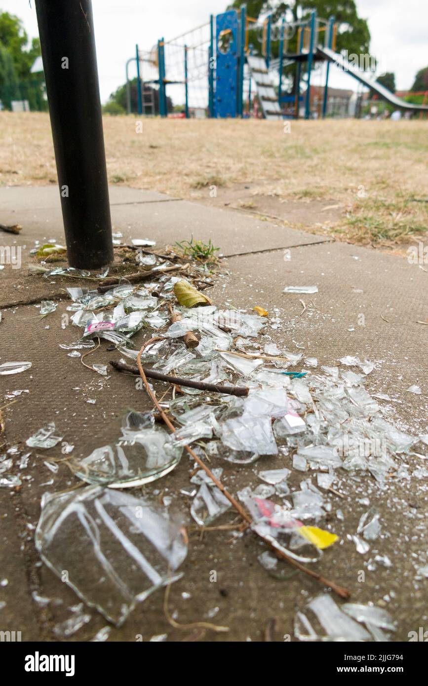 Broken glass bottle, left by vandal, in a children's child's playground ...