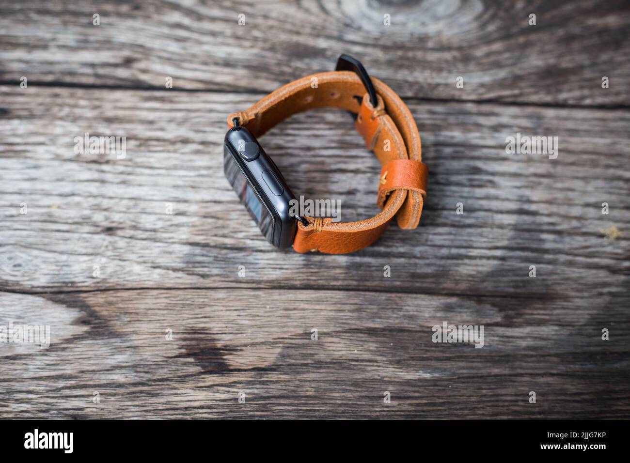 Genuine brown leather watch strap on wood background, Craftsmanship ...