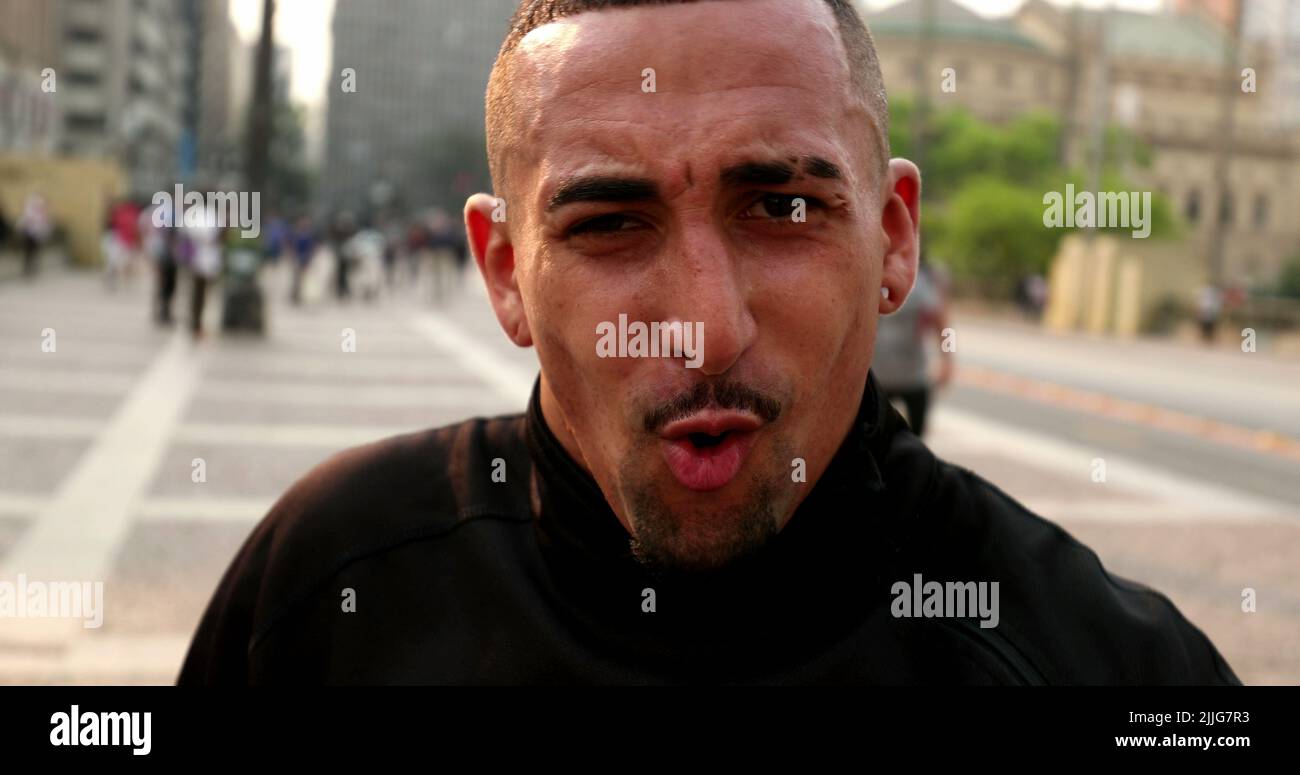Urban dancer performing street dance with face only in city background ...
