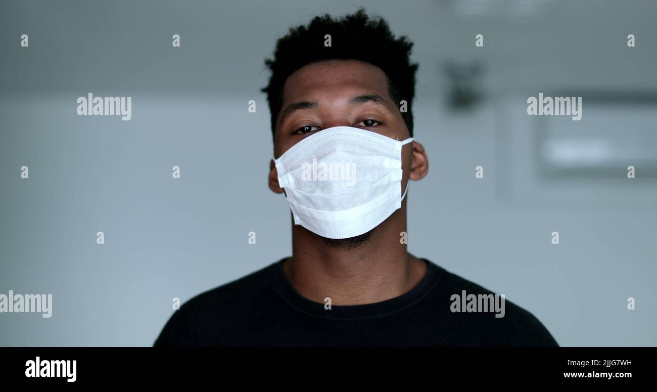 Young black African man wearing surgical face mask Stock Photo - Alamy