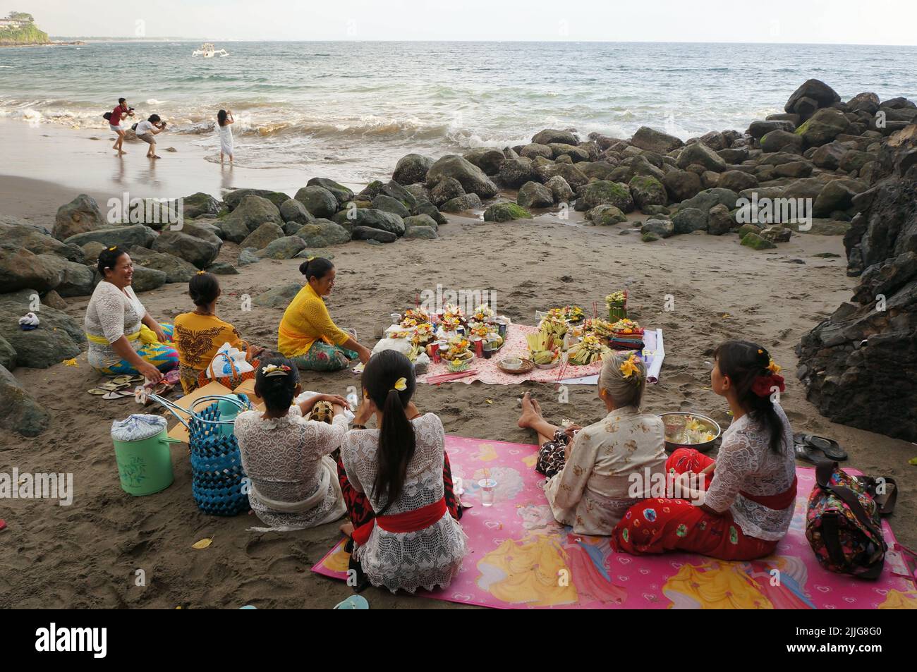 Lombok, Indonesia - Hindu people eat food together after a ritual at ...
